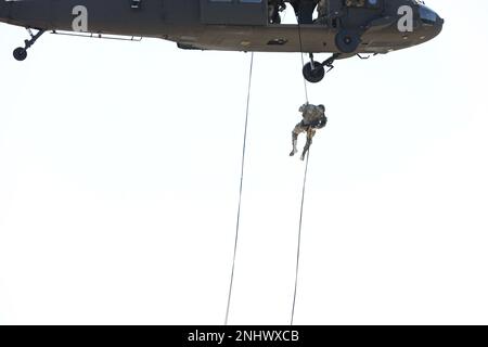 Soldier rappelling out of Black Hawk helicopter at the Gowen Thunder ...