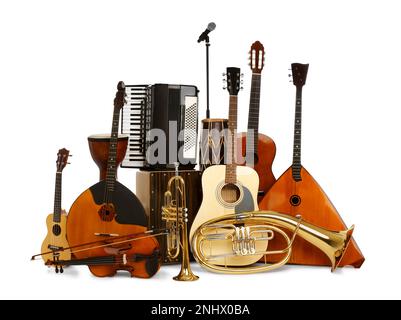 Set of different musical instruments and microphone on white background ...