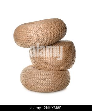 Three stylish wicker poufs on white background Stock Photo - Alamy