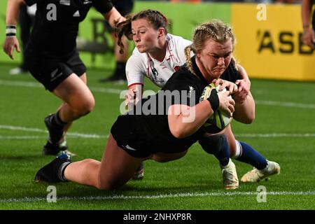 England's Lucy Packer, top, is unable to stop New Zealand's Amy Rule ...