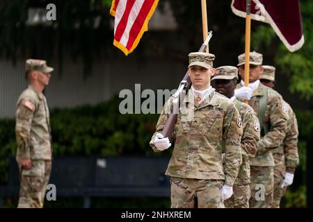 Command Sgt. Maj. Blake Wise accepts the colors for Troop Battalion at ...