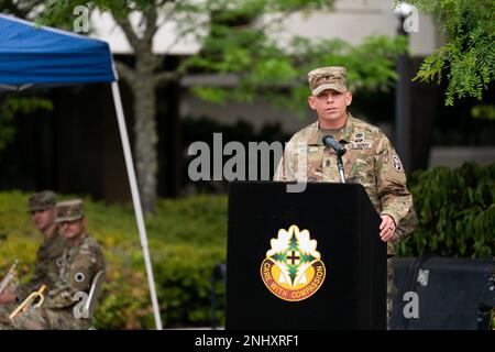 Command Sgt. Maj. Blake Wise accepts the colors for Troop Battalion at ...