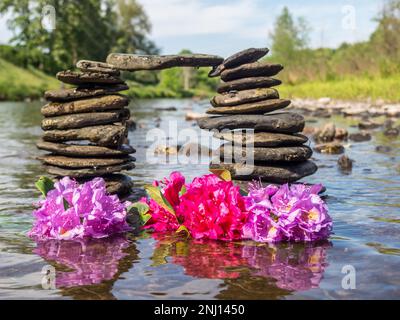 Balance stone in a river 02 Stock Photo - Alamy