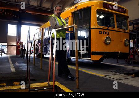 Superintendent of bus maintenance Louis Guzzo shows historic buses ...