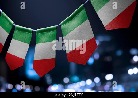 A garland of Italy national flags on an abstract blurred background ...