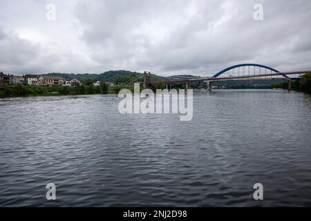 The Ohio River, spanned by the Wheeling Suspension Bridge and Fort ...