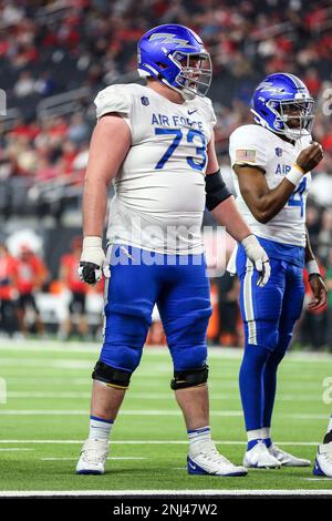 Air Force offensive lineman Isaac Cochran, second row at left, smiles ...