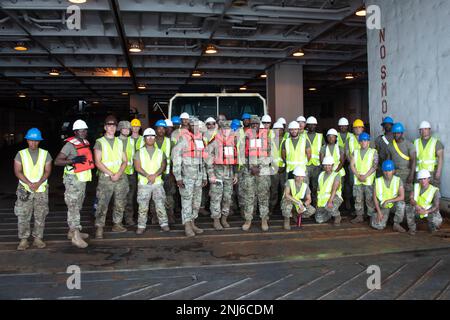 Military vehicles aboard the USNS Bob Hope begin their voyage across ...