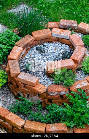 Brick circle for herbal garden Stock Photo - Alamy