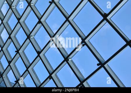 Below view of glass roof consisting of square and triangle segments ...