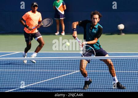 Ozan Baris and Nishesh Basavareddy during a junior boys' doubles match ...