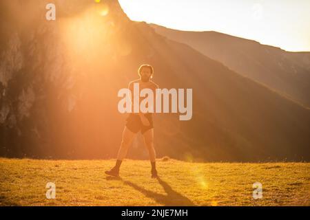 Man boxing with shadow exercising at sunset outdoor. Port victory ...