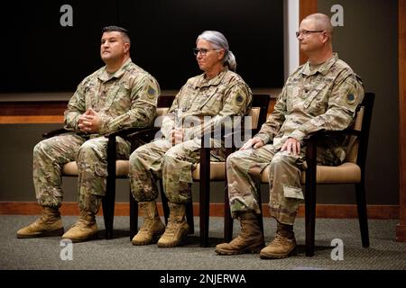 Chief Warrant Officer (4) Peggy Bates hugs friends after her retirement ...