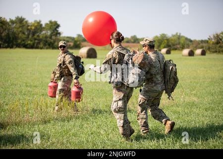 Soldiers in the communication center in Camp Able Sentry respond to a ...