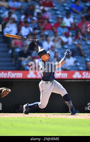 Seattle Mariners' Julio Rodriguez swings through after hitting a solo ...