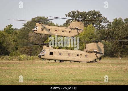 Soldiers in the communication center in Camp Able Sentry respond to a ...