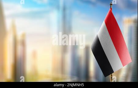 Small flags of the Yemen on an abstract blurry background Stock Photo ...
