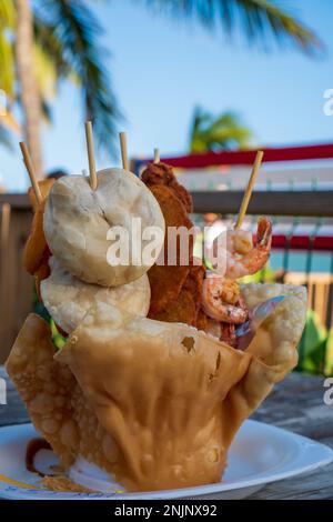 Puerto Rico street food of seafood mix on fry Doug cup Stock Photo - Alamy