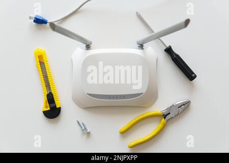 Repairing tools with a wireless wifi router on the table Stock Photo ...