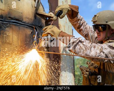 U.S. Marines and airmen attached to the Method of Entry School, Weapons ...