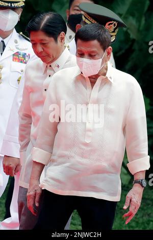Philippine President Rodrigo R. Duterte smiles as he views two custom ...