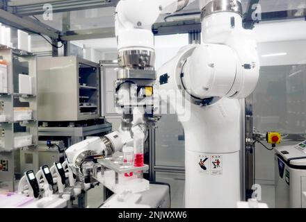 Mahoro, a humanoid lab assist robot holds test tubes at RIKEN, in Kobe ...