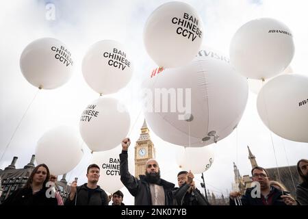 Protesters from the Big Brother Watch lobby group hold large white ...