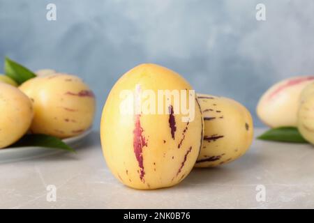Fresh ripe pepino melons on orange background, flat lay Stock Photo - Alamy