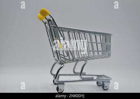 Empty supermarket trolley miniature version Stock Photo - Alamy