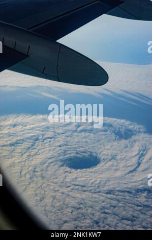 Cyclone seen from the window of a commercial flight over the coast of ...