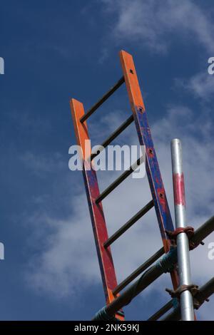 Metal ladder leaning against scaffolding Stock Photo - Alamy