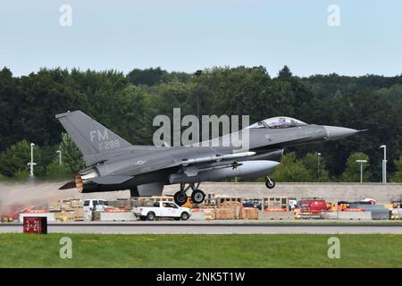 Pilots assigned to the 115th Fighter Wing take part in a flyover during ...