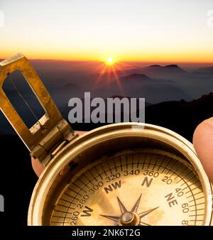 Old compass in the mountain Stock Photo - Alamy