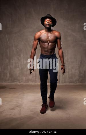 Muscular young man near concrete slab Stock Photo - Alamy