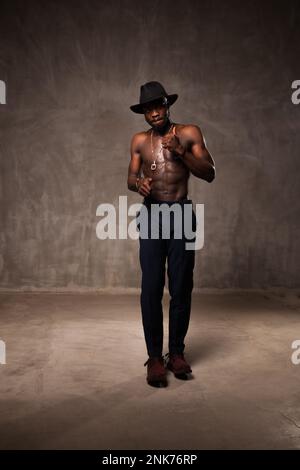 Muscular young man near concrete slab Stock Photo - Alamy