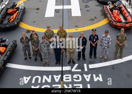 A Philippine Coast Guard personnel, left, participate in a drill on ...