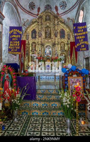 The elaborate gilded altarpeice or retablo of the Spanish colonial ...