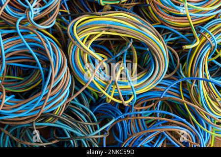 Colorful, coiled copper cables in rubber sheaths. Prepared for further ...
