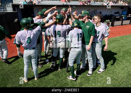 Siena Saints team huddle before an NCAA baseball game against the UCF ...
