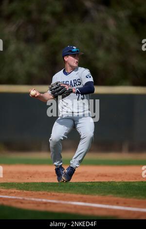 BYU Cougars third baseman Austin Deming (25) throws to first base ...