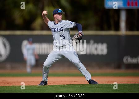 BYU Cougars third baseman Austin Deming (25) throws to first base ...