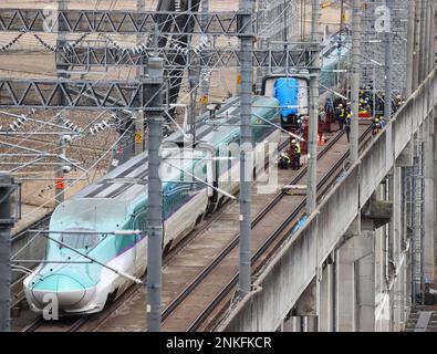 Technical experts of JR East Railway Co. conduct a restoration work ...