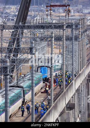 Technical experts of JR East Railway Co. conduct a restoration work ...