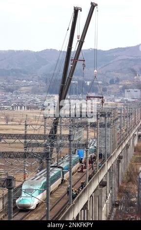 Technical experts of JR East Railway Co. conduct a restoration work ...