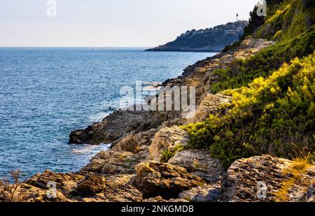 Rocky shoreline landscape of Saint-Jean-Cap-Ferrat resort town on Cap ...