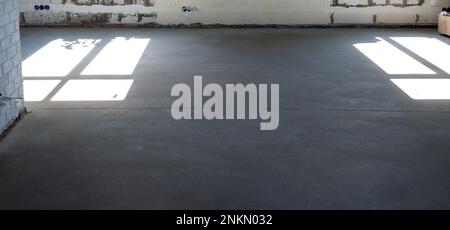 The leveled rough floor in a house under construction with a semi-dry ...