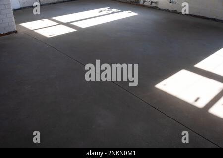 The leveled rough floor in a house under construction with a semi-dry ...