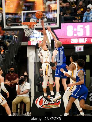 Drake guard Garrett Sturtz (3) shoots as Bradley guard Duke Deen, right ...