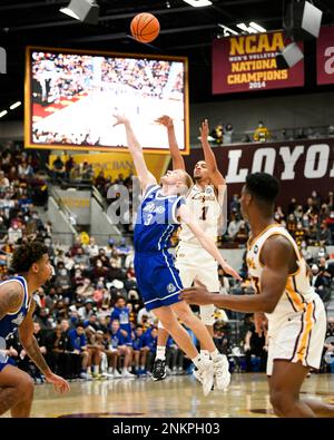 Drake guard Garrett Sturtz (3) shoots as Bradley guard Duke Deen, right ...