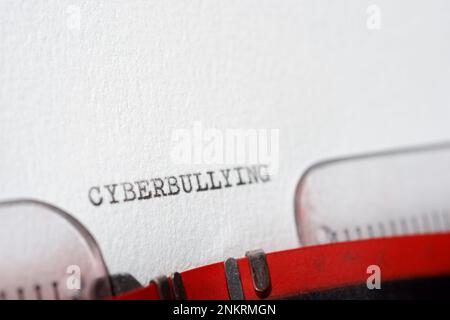 Cyberbullying word written with a typewriter Stock Photo - Alamy